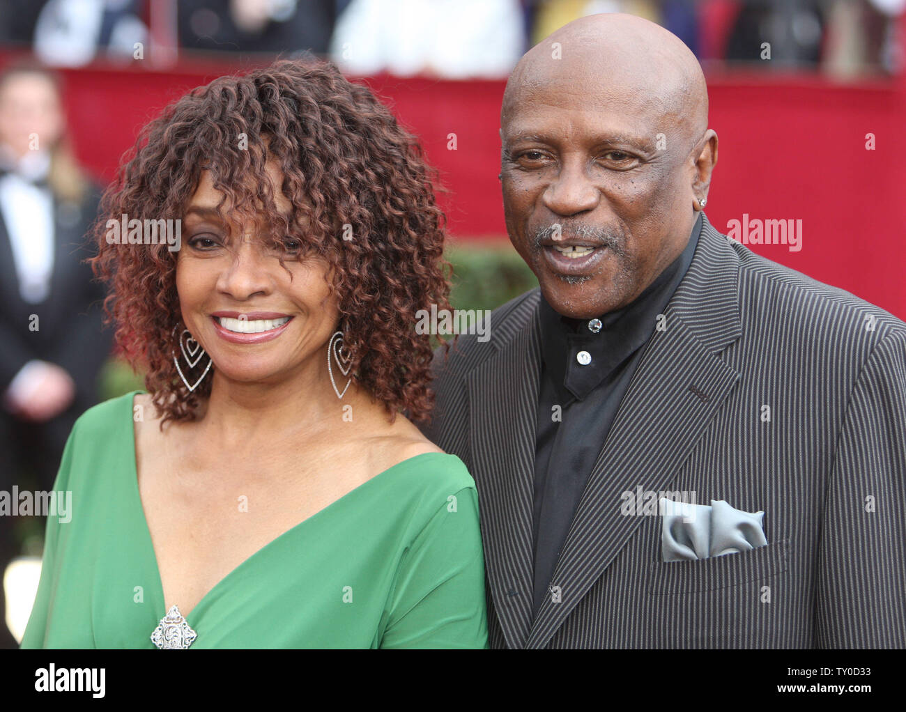 Louis Gossett Jr. (R) and his guest arrive for the 80th Annual Academy ...