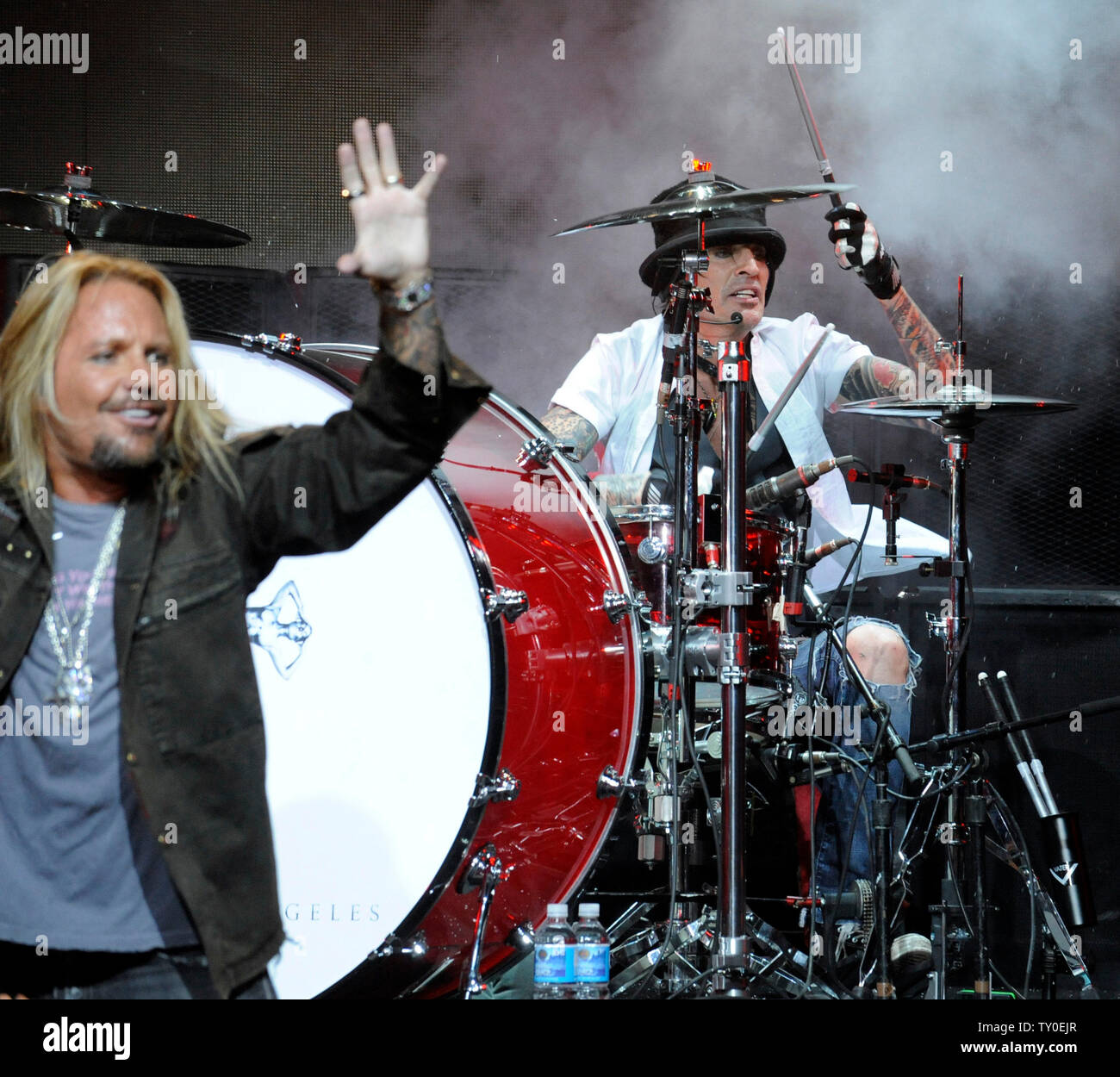 Drummer Tommy Lee (R) and lead singer Vince Neil of Motley Crue perform ...