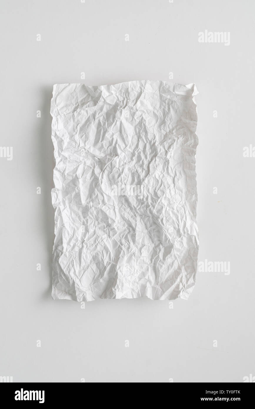 flat lay crumpled white paper sheet isolated on the table, background ...