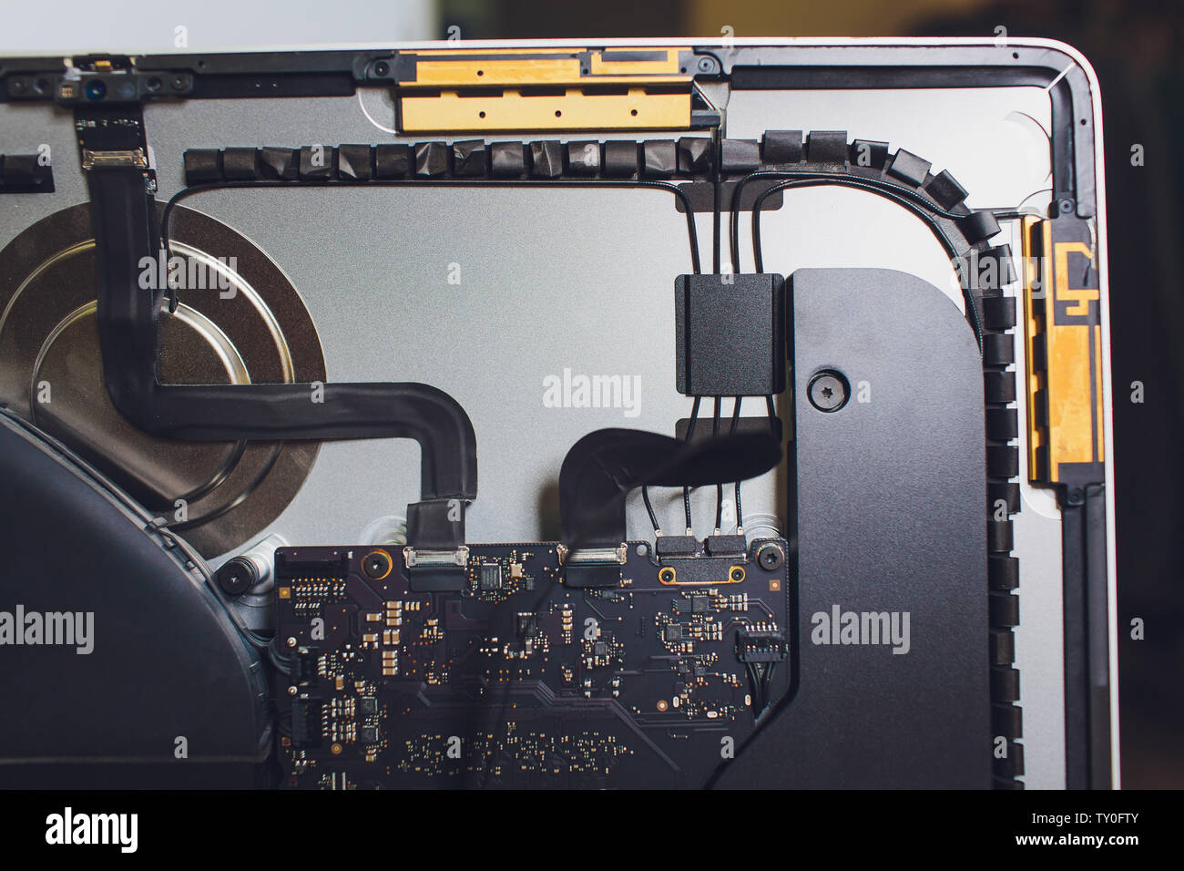 Process of computer repair. Engineer in white gloves disassembling ...