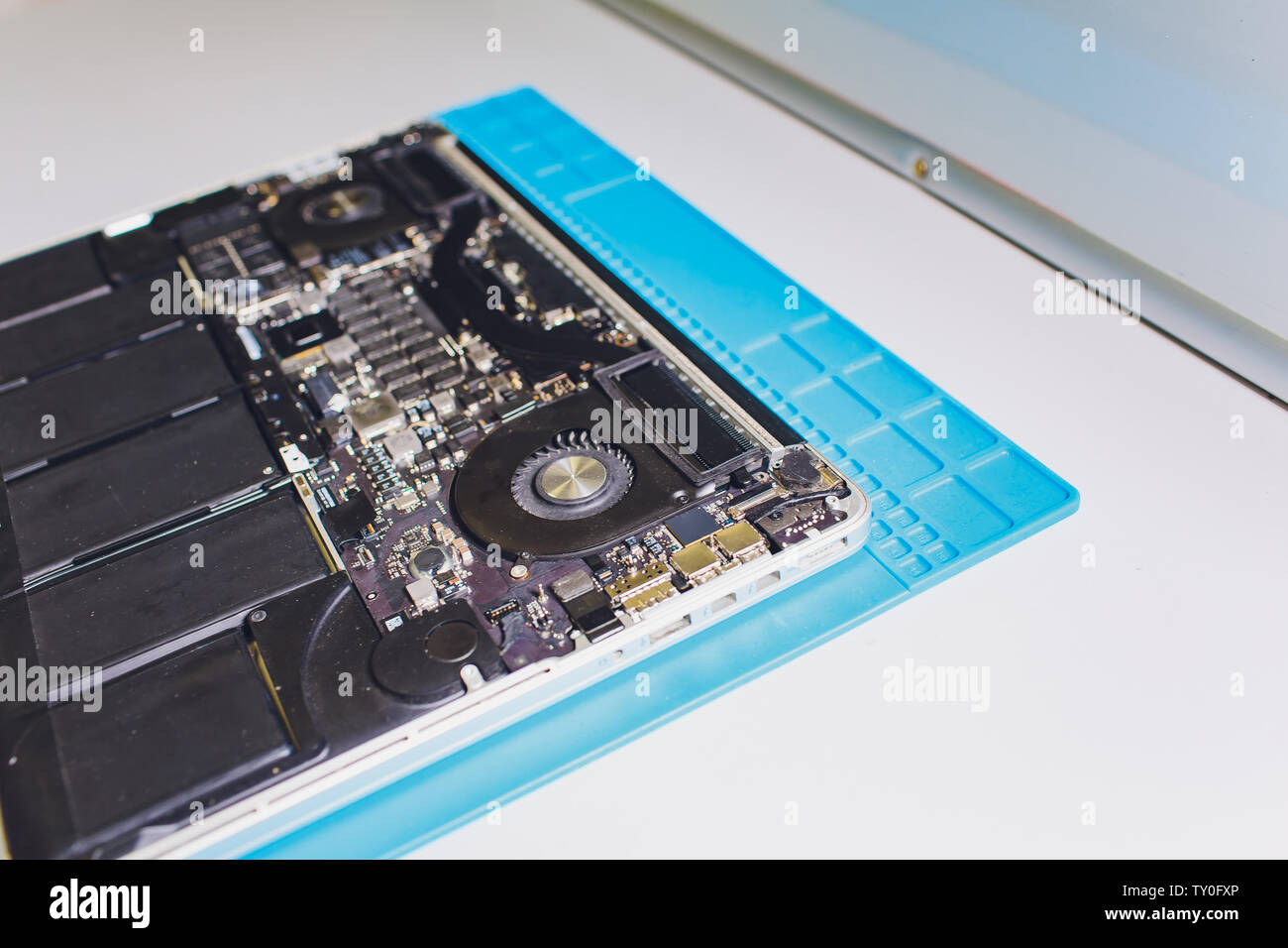 The engineer repairs the laptop pc, computer and the motherboard ...