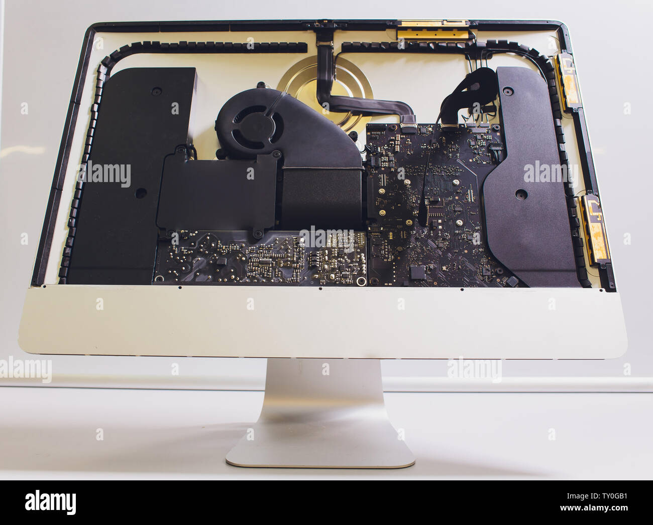 Process of computer repair. Engineer in white gloves disassembling ...