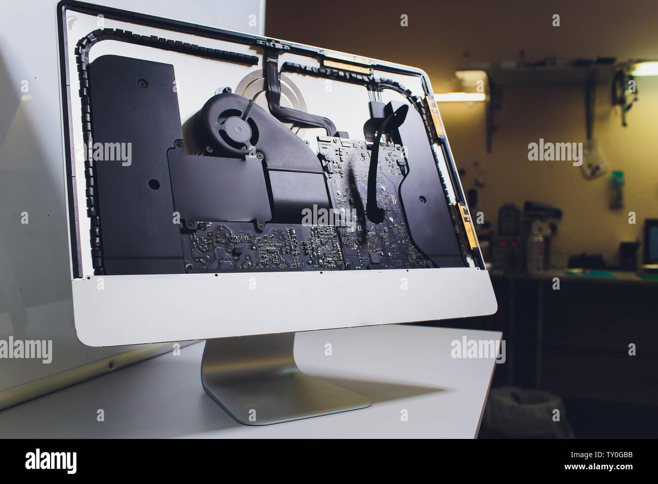 Process of computer repair. Engineer in white gloves disassembling ...