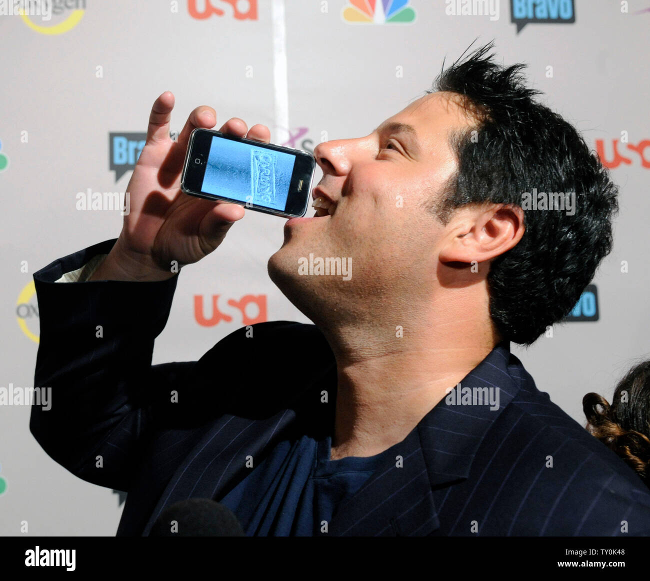 Actor Greg Grunberg, star of the series "Heroes", pretends to drink ...