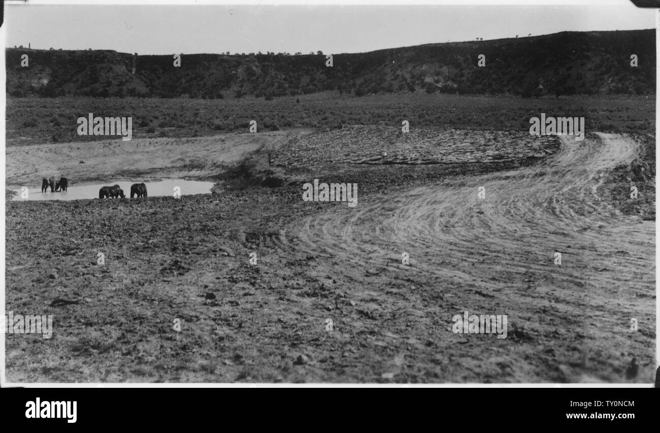 Dirt reservoir with rocked face and deep borrow pit Stock Photo - Alamy