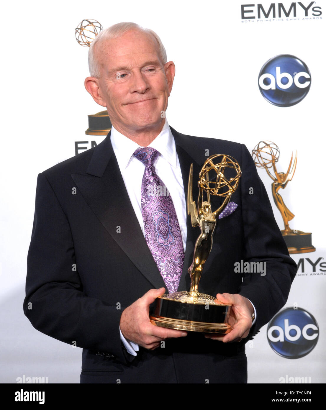 Tommy Smothers holds his special Emmy Award backstage at the 60th ...