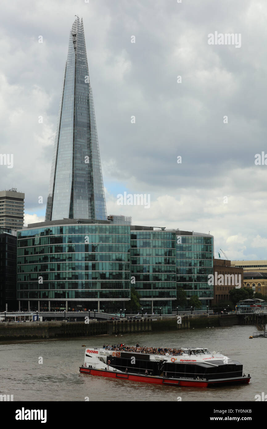 London on a grey day seen from Tower Bridge over the Thames and the ...