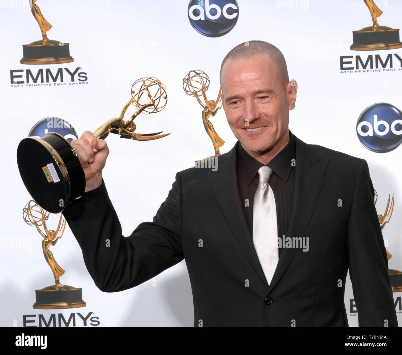 Bryan Cranston holds his Emmy for outstanding lead actor in a drama ...