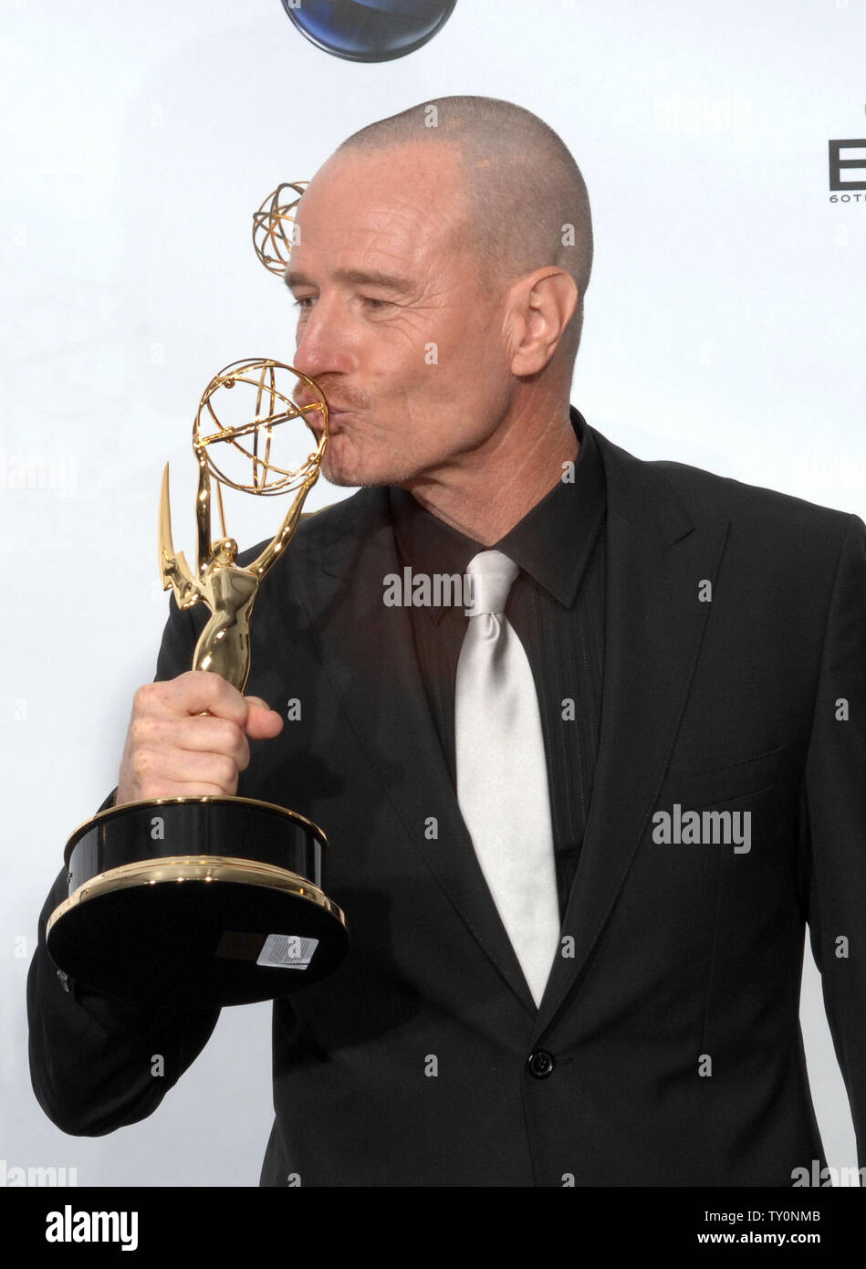 Bryan Cranston holds his Emmy for outstanding lead actor in a drama ...