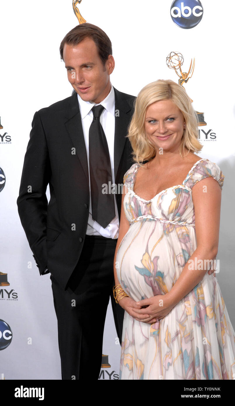 Amy Poehler And Her Husband Will Arnett Appear Backstage At The 60th Primetime Emmy Awards At