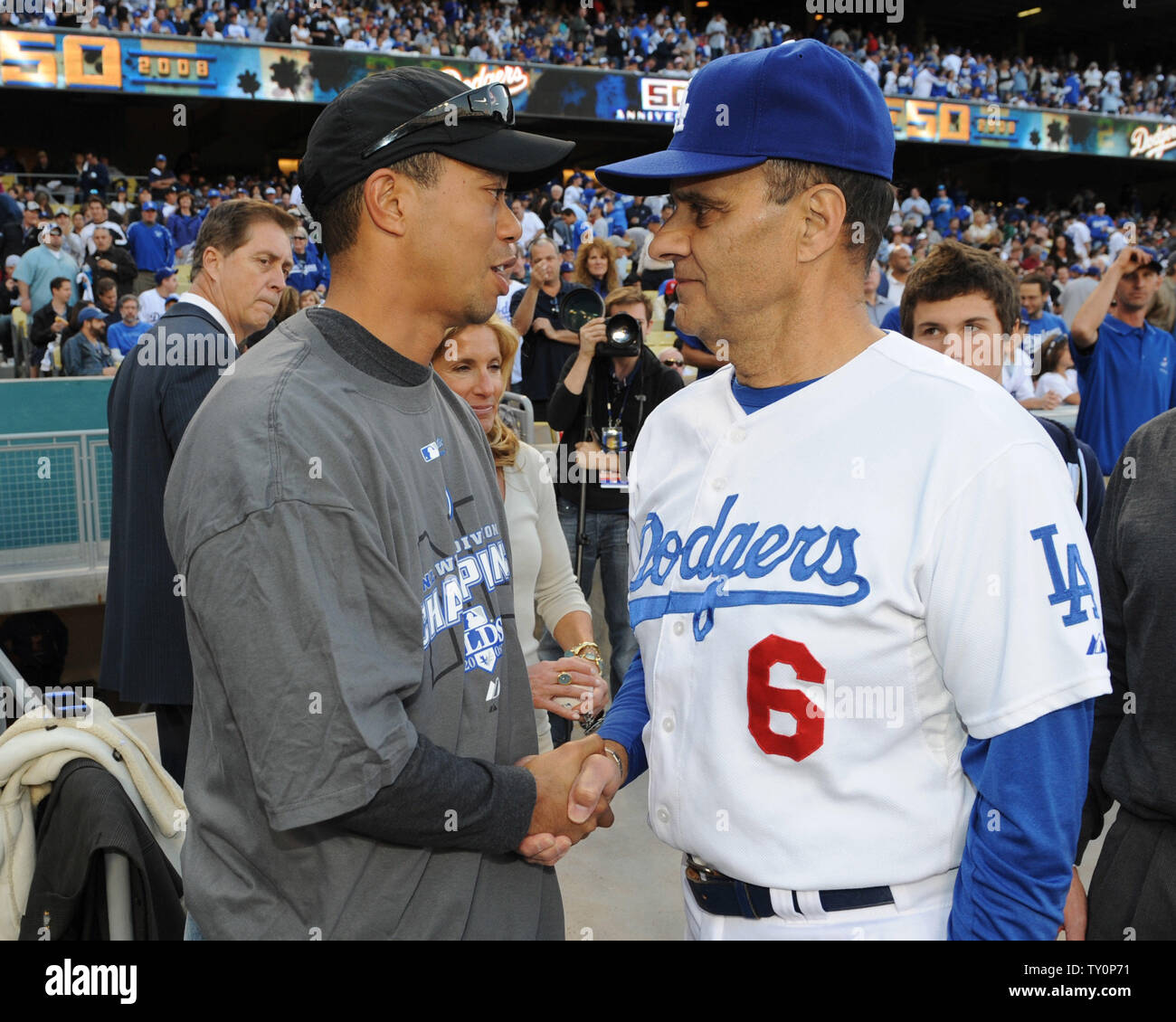 Los Angeles Dodgers Manager Joe Torre speaks with Tiger Woods prior to ...