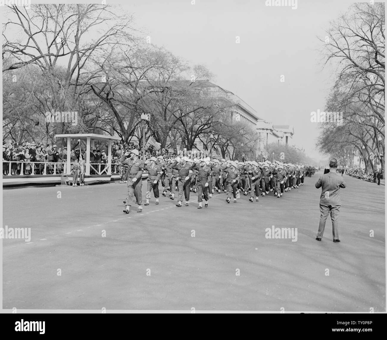 Distance view of President Truman in reviewing stand watching soldiers ...