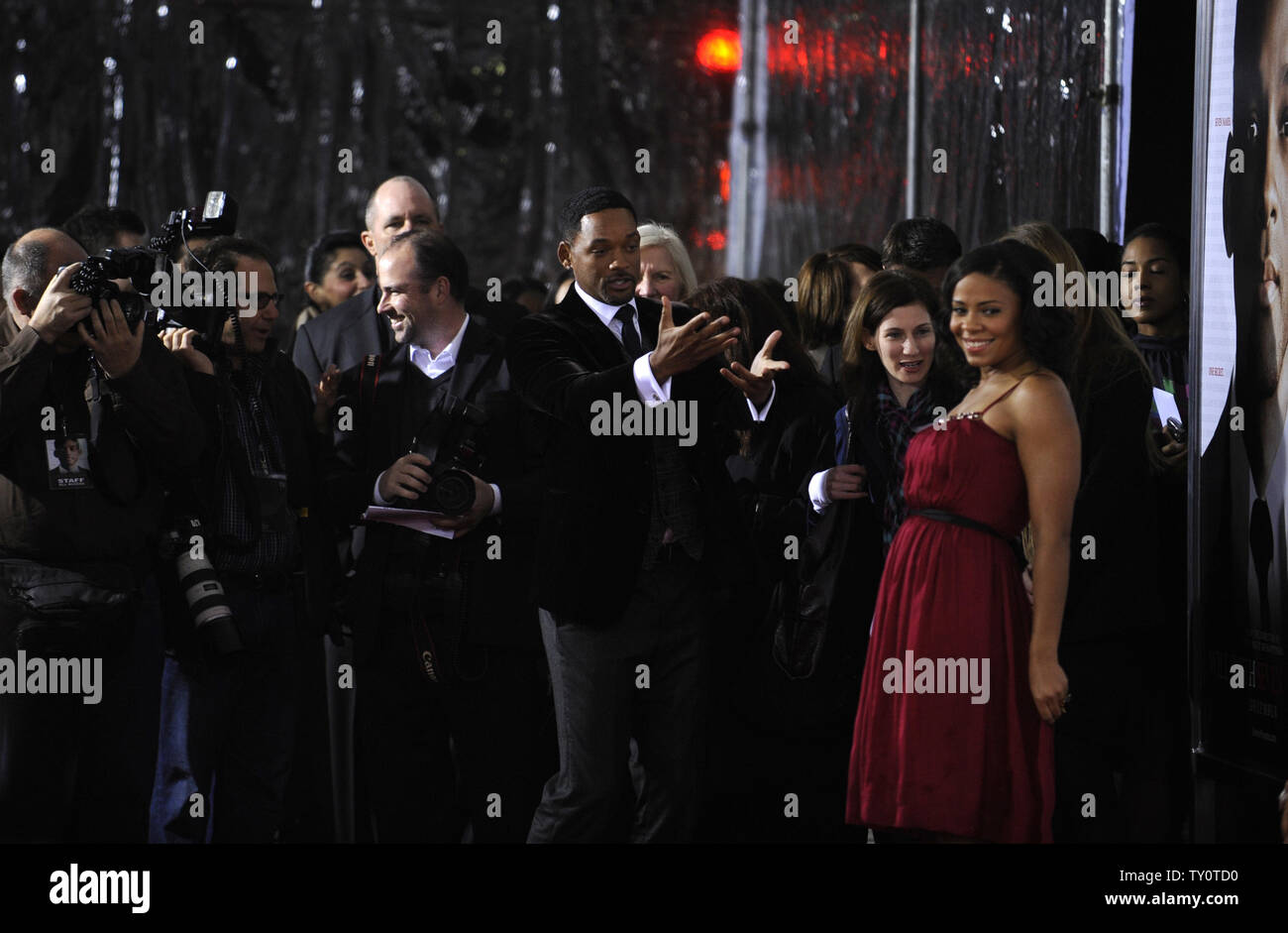 Cast member Will Smith (C) gestures to actress Sanaa Lathan at the ...