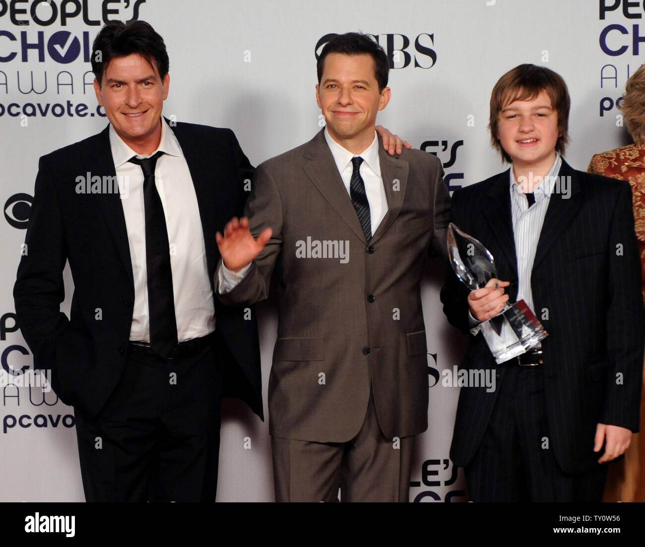 Charlie Sheen (L), Jon Cryer (C) and Angus T. Jones appear backstage ...