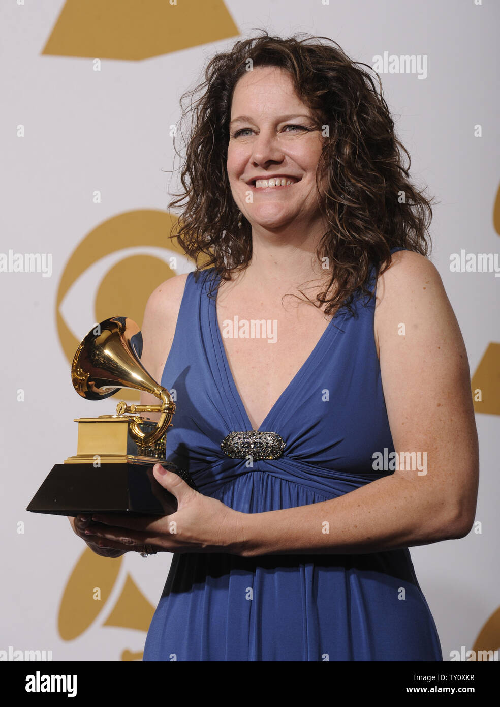 Kelly Carlin McCall holds the Grammy Award won by her late father ...