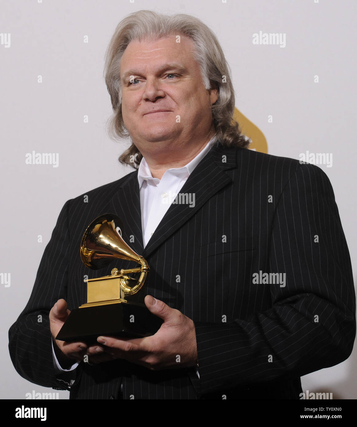 Ricky Skaggs holds his Grammy Award for Best Bluegrass Album at the ...