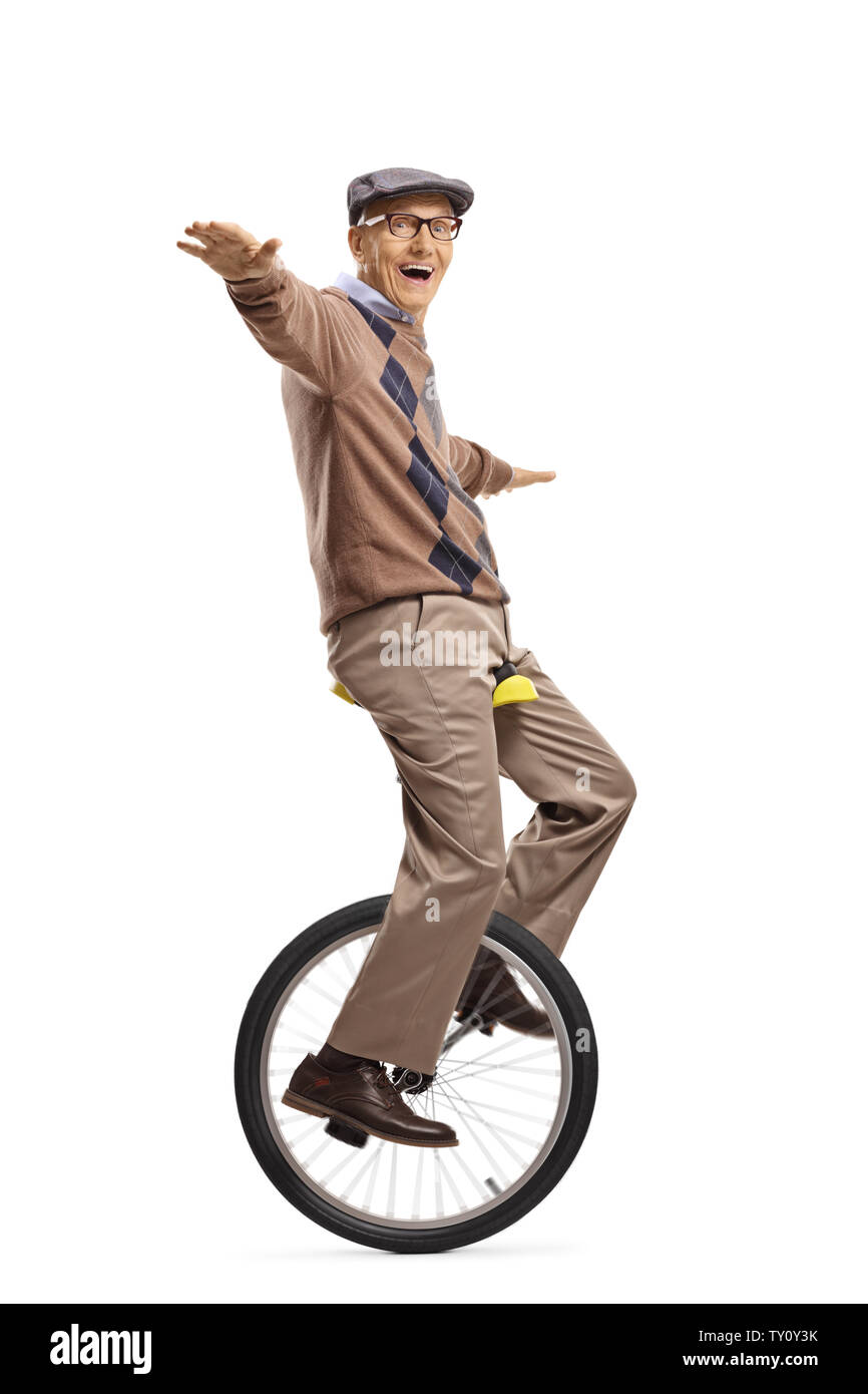 Full length shot of a senior man riding a mono-cycle and balancing with ...