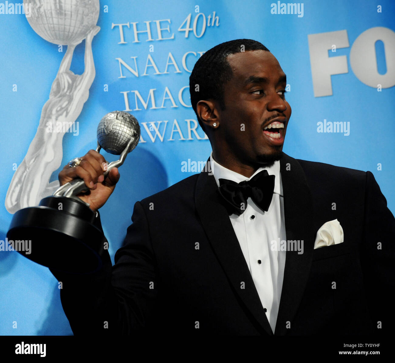 Sean "P. Diddy" Combs appears backstage with the award he garnered for ...