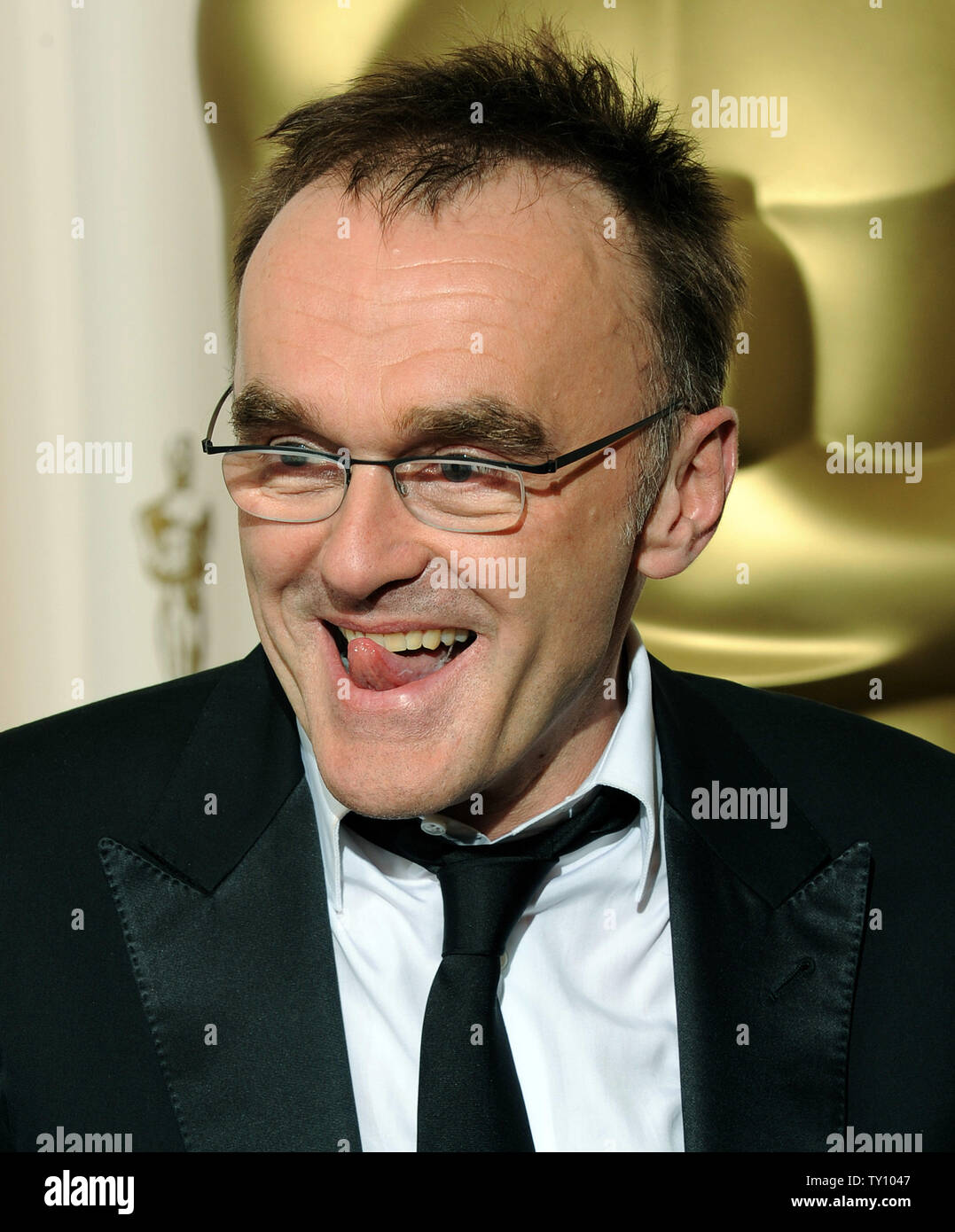 Director Danny Boyle holds his Oscar for best director for his film ...
