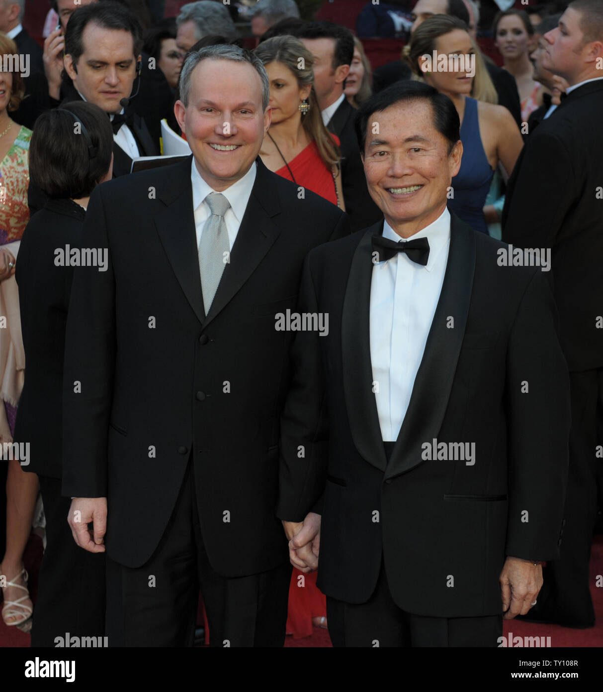 Actor George Takei (R) his partner Brad Altman arrive at the 81st ...