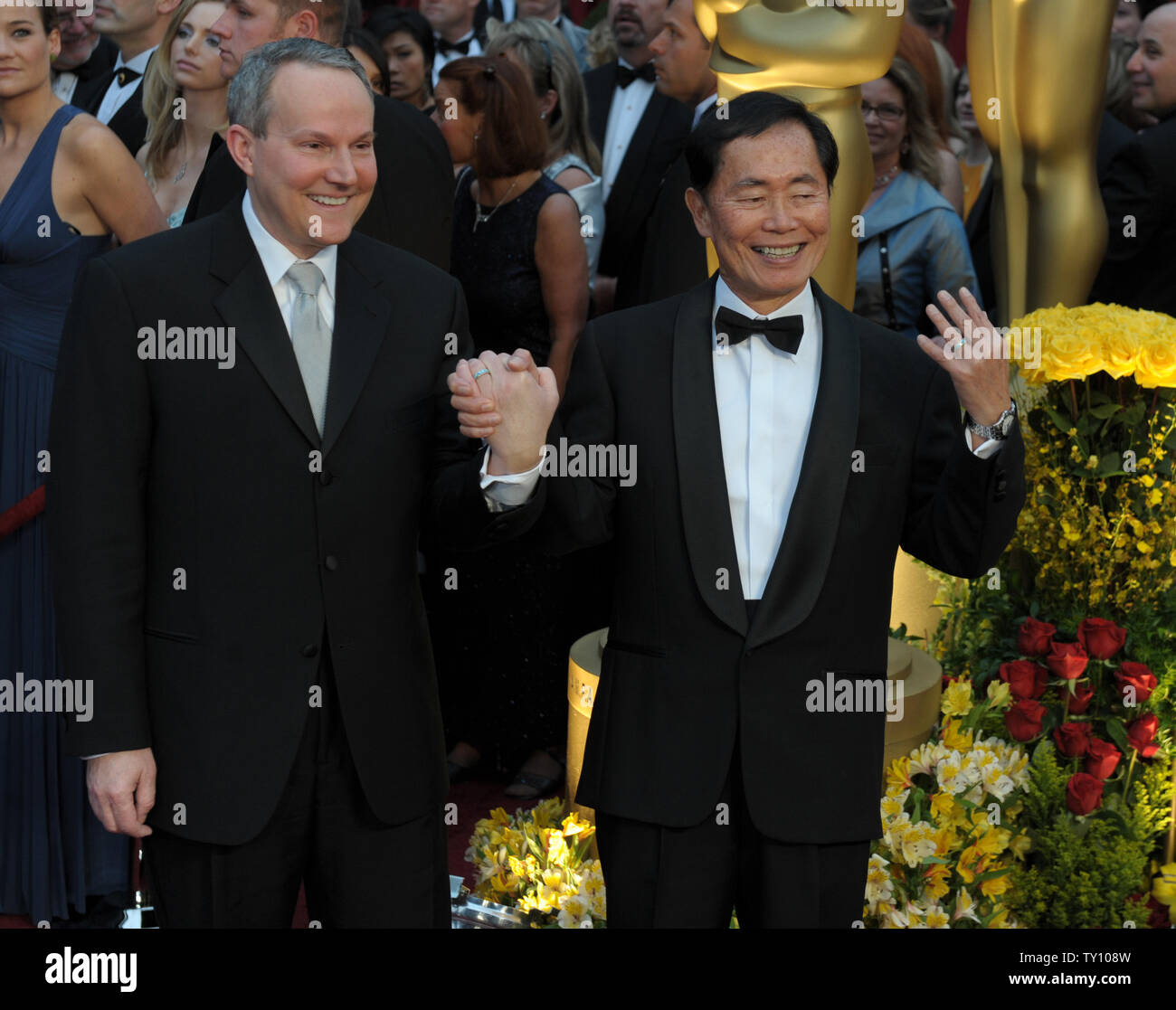 Actor George Takei (R) his partner Brad Altman arrive at the 81st ...