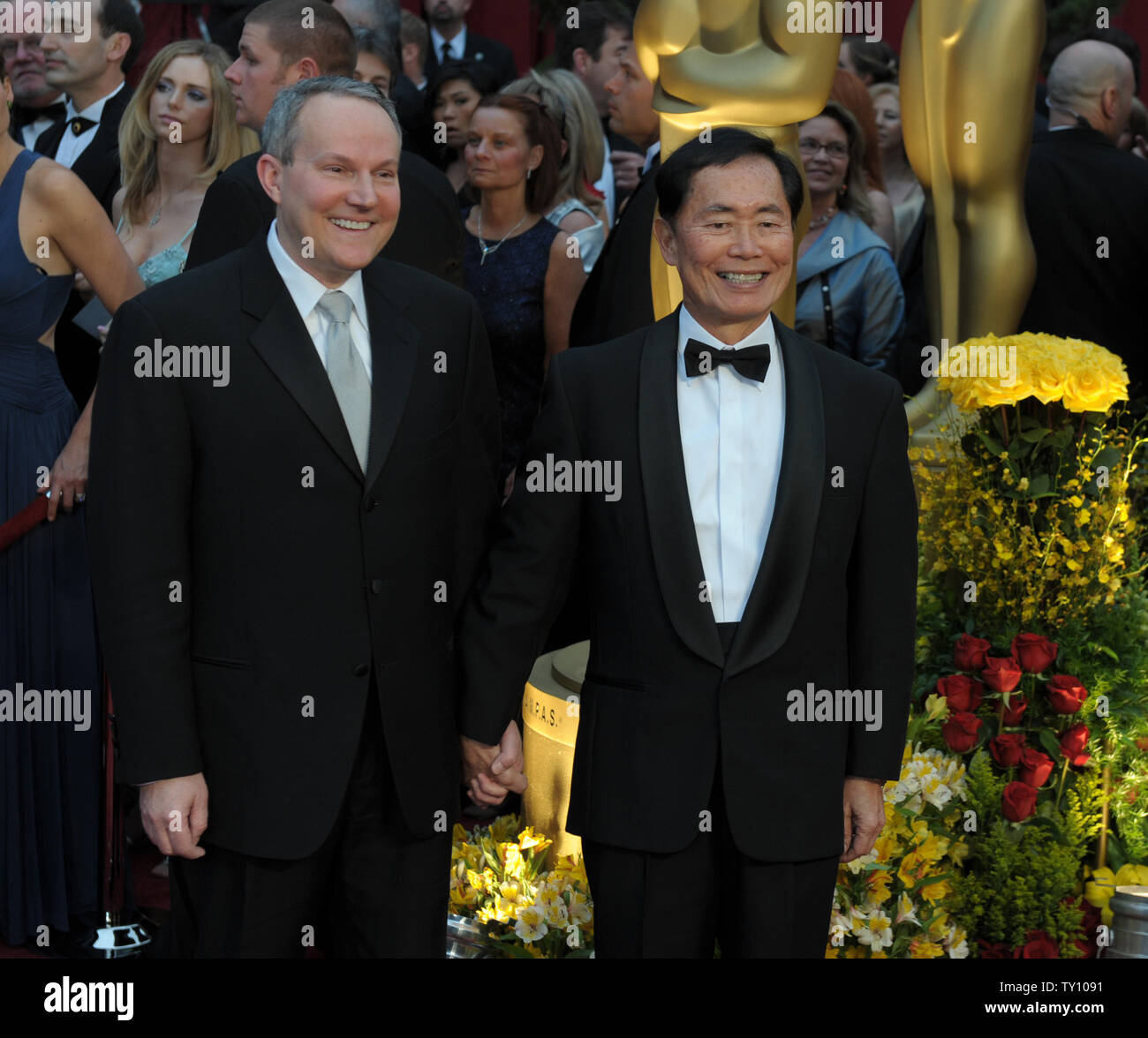 Actor George Takei (R) his partner Brad Altman arrive at the 81st ...