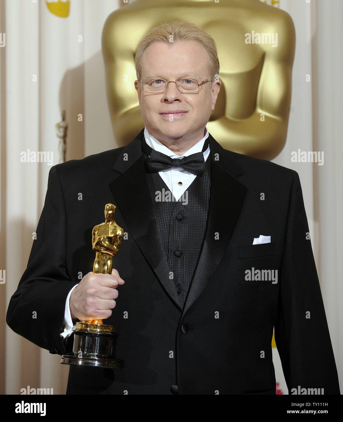Greg Cannom holds his Oscar for makeup for the film "The Curious Case ...