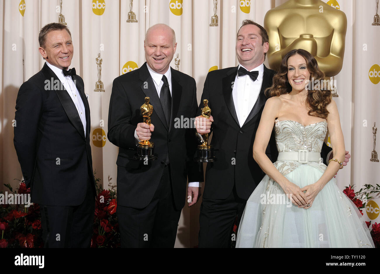Donald Graham Burt (2nd L) and Victor J. Zolfo (2nd R) hold their ...