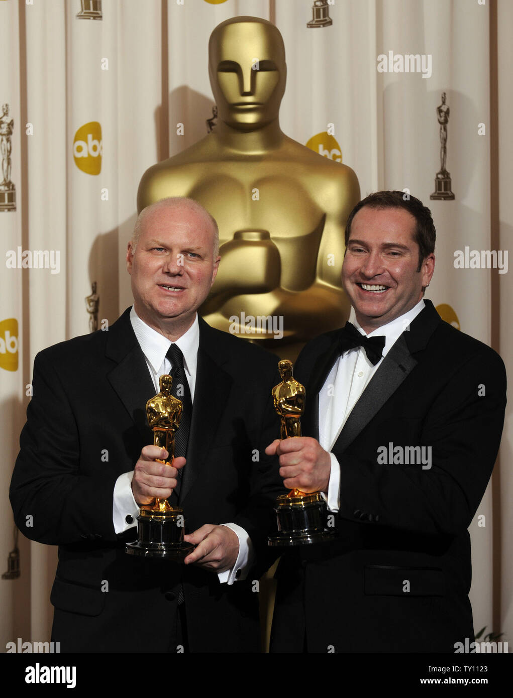 Donald Graham Burt (L) and Victor J. Zolfo hold their Oscars for ...