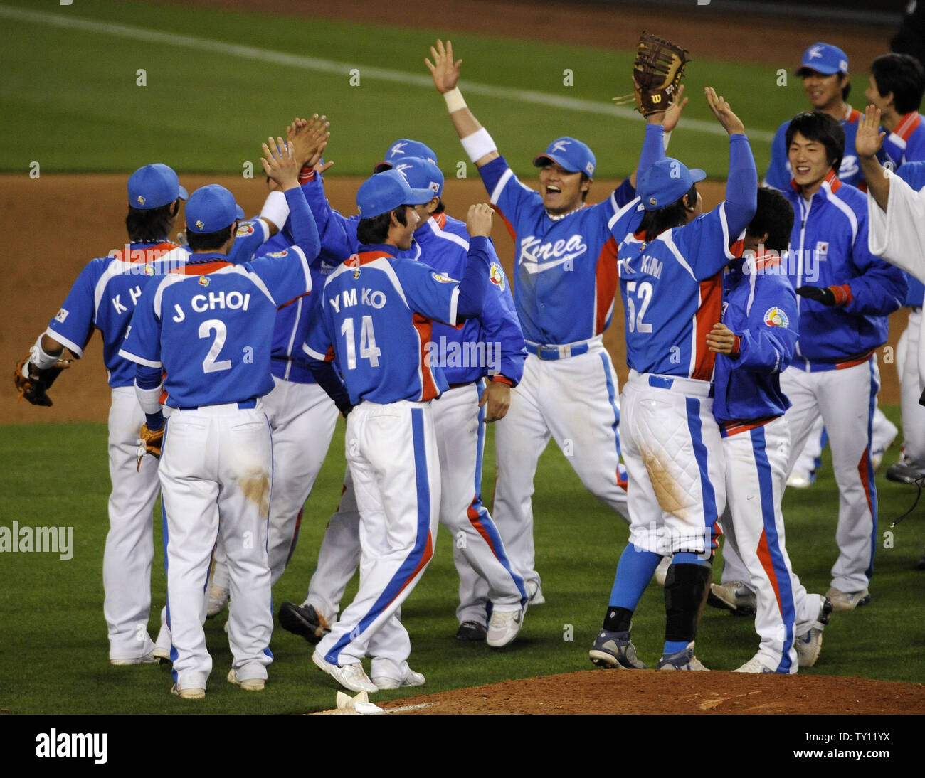 Korea celebrates it's 10-2 victory over Venezuela after their World ...