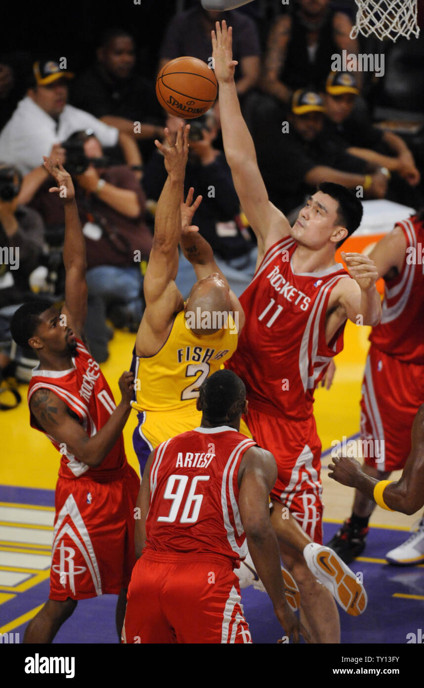 Los Angeles Lakers' Derek Fisher (2) goes to the basket as the Houston ...