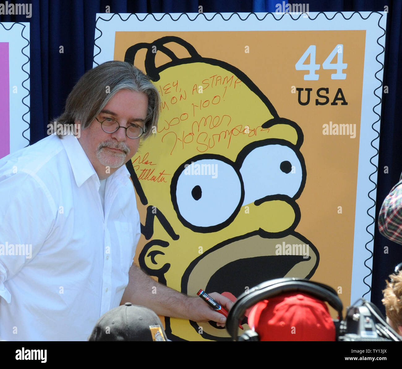 Creator and Executive Producer Matt Groening signs a poster at the ...