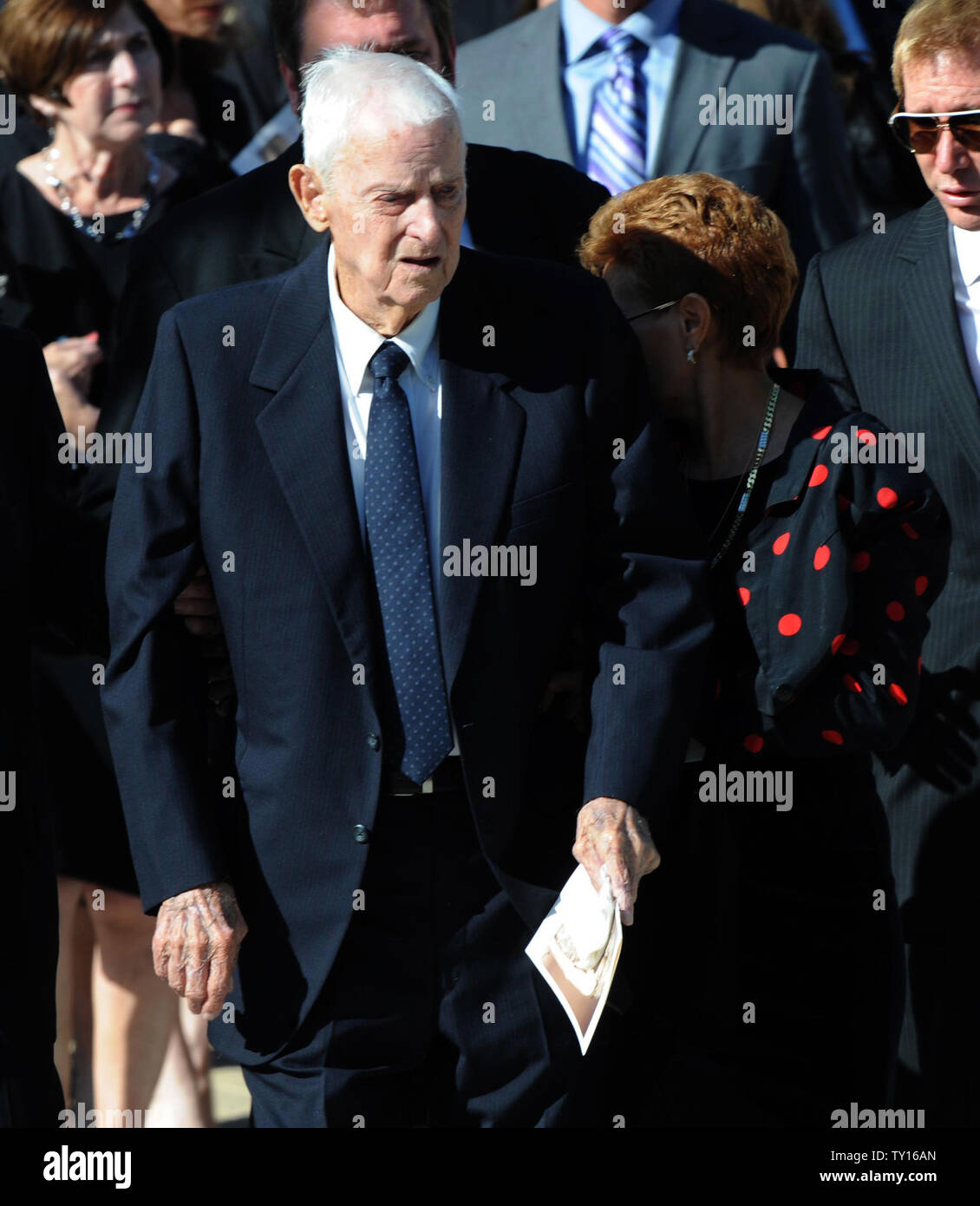 James Fawcett, father of late actress Farrah Fawcett is assisted to his ...