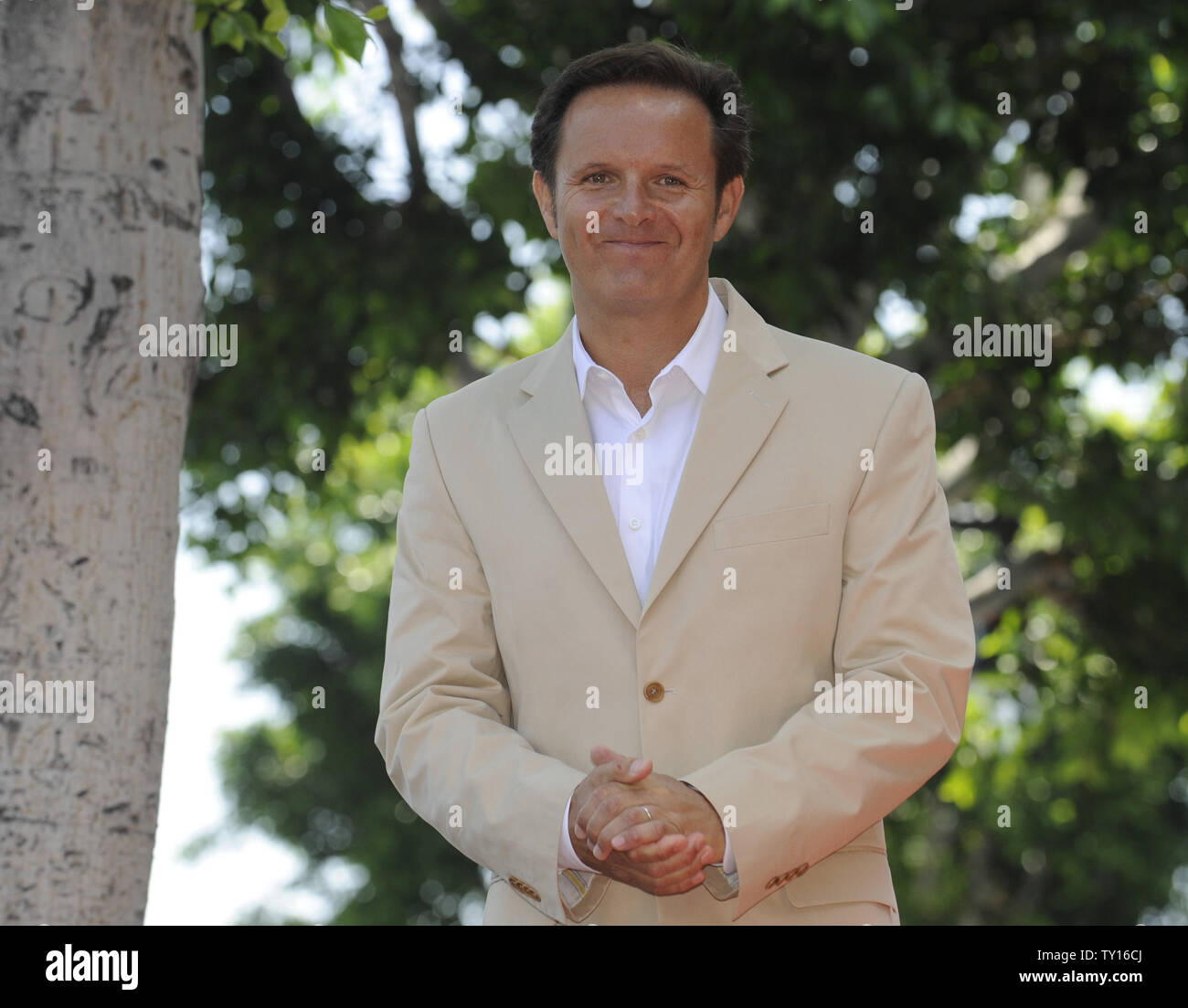 Producer Mark Burnett attends a ceremony where he receives a star on ...