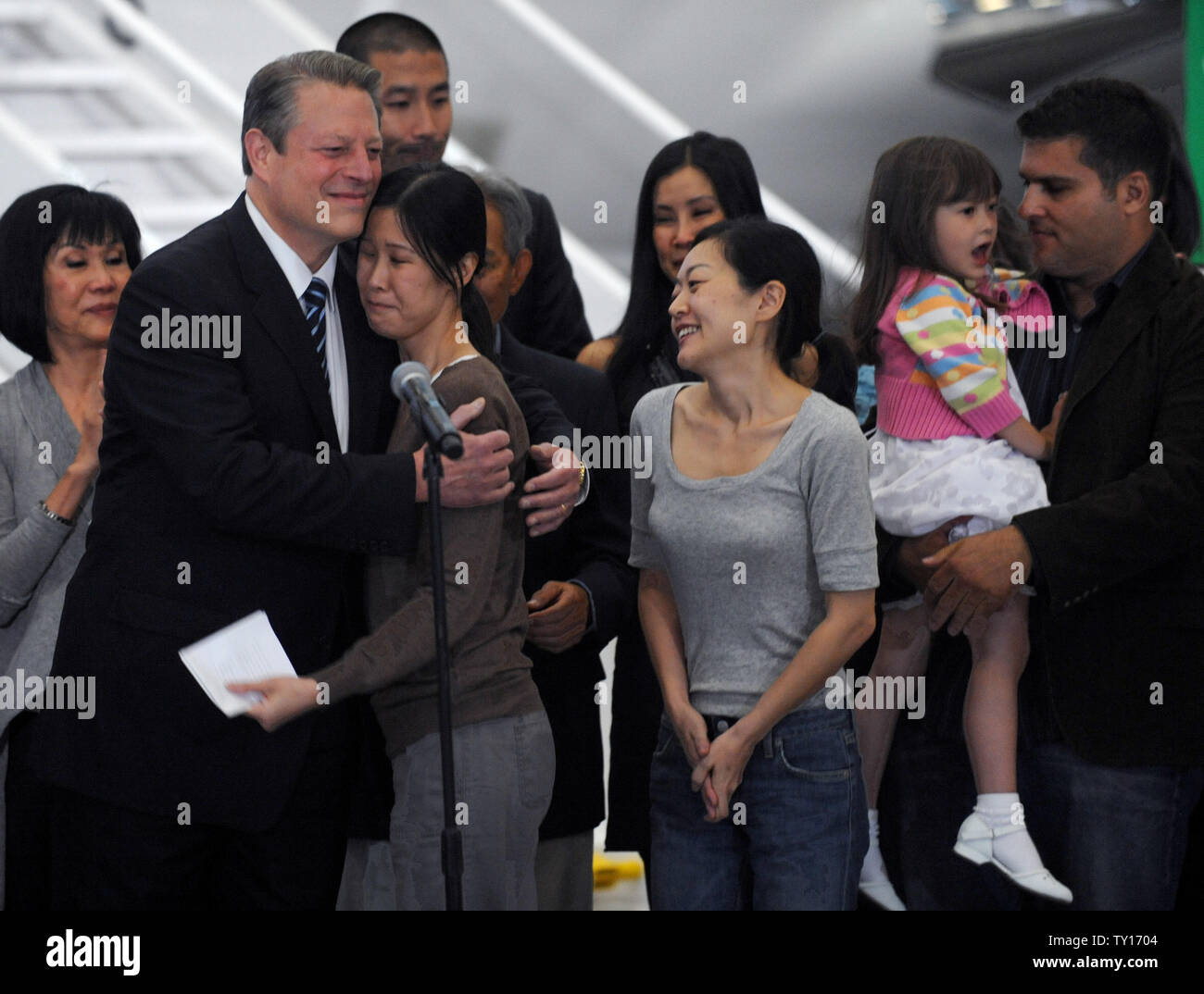 Former vice President Al Gore hugs Laura Ling (2nd-L) as Euna Lee (3rd ...