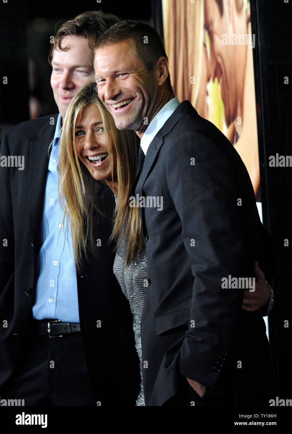 Actors Jennifer Aniston (C), Aaron Eckhart (R) and director Brandon ...