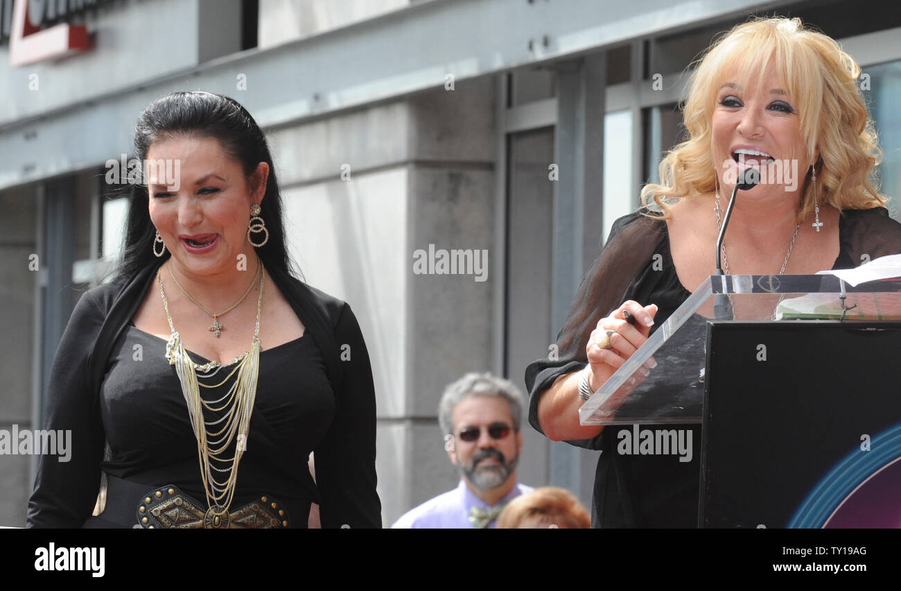 Singer Crystal Gayle (L) reacts as Tanya Tucker makes remarks during an ...