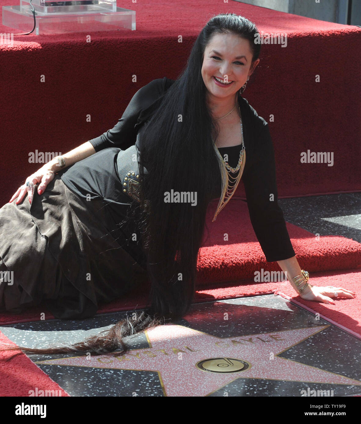 Singer Crystal Gayle places her signature mane atop her star during an ...