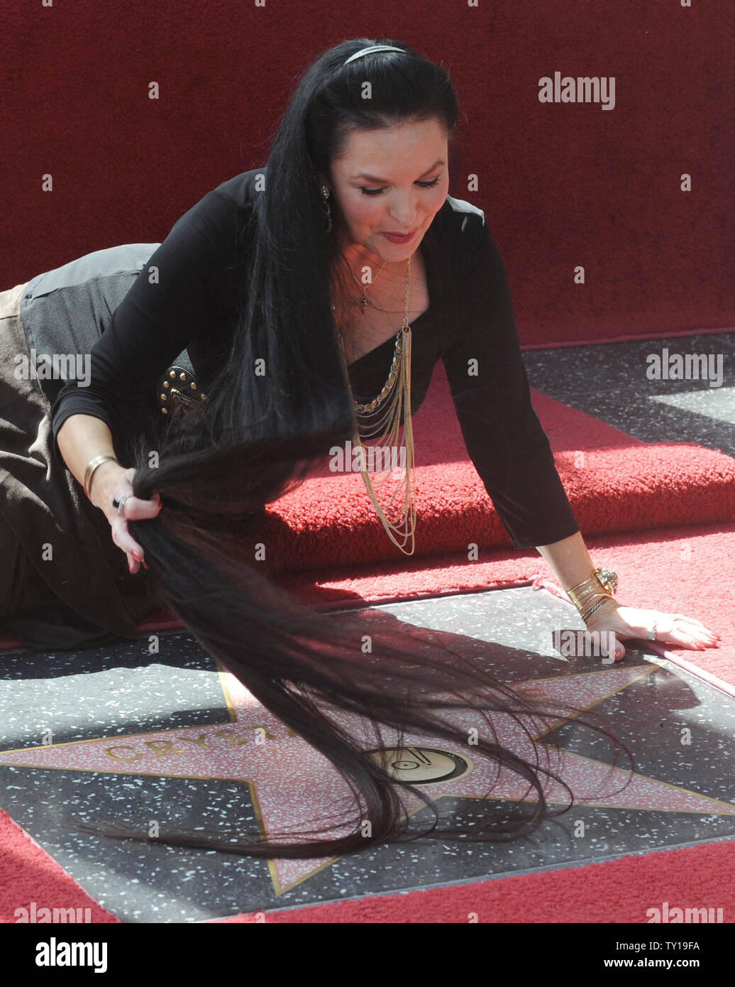 Singer Crystal Gayle places her signature mane atop her star during an ...