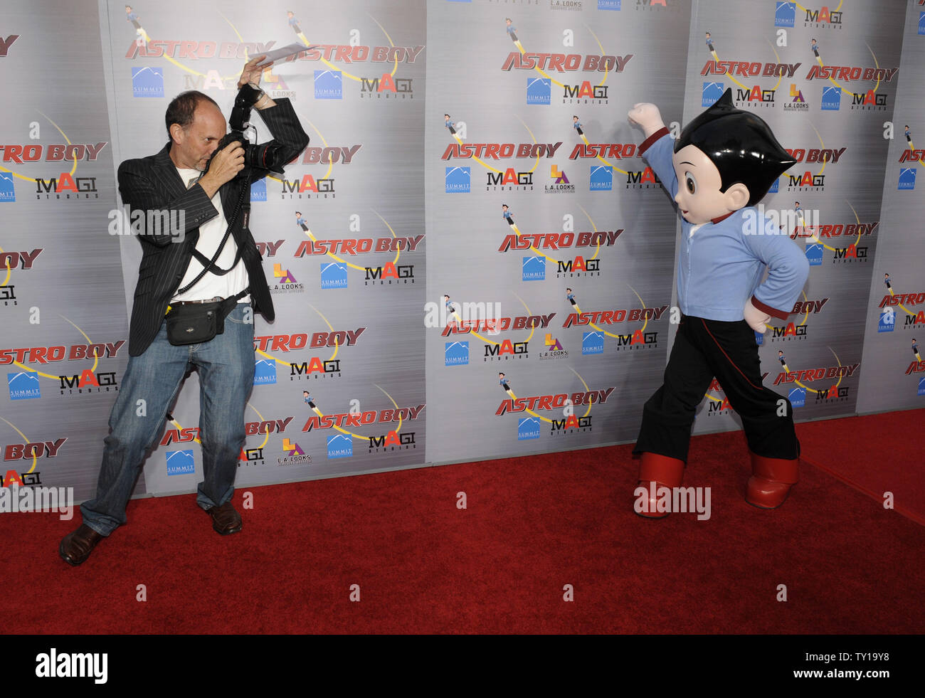 A performer in the costume of Astro Boy attends the premiere of the ...