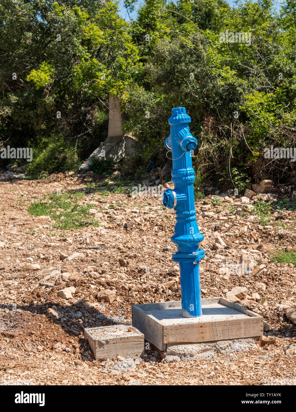 Newly installed blue fire hydrant in Croatia Stock Photo - Alamy