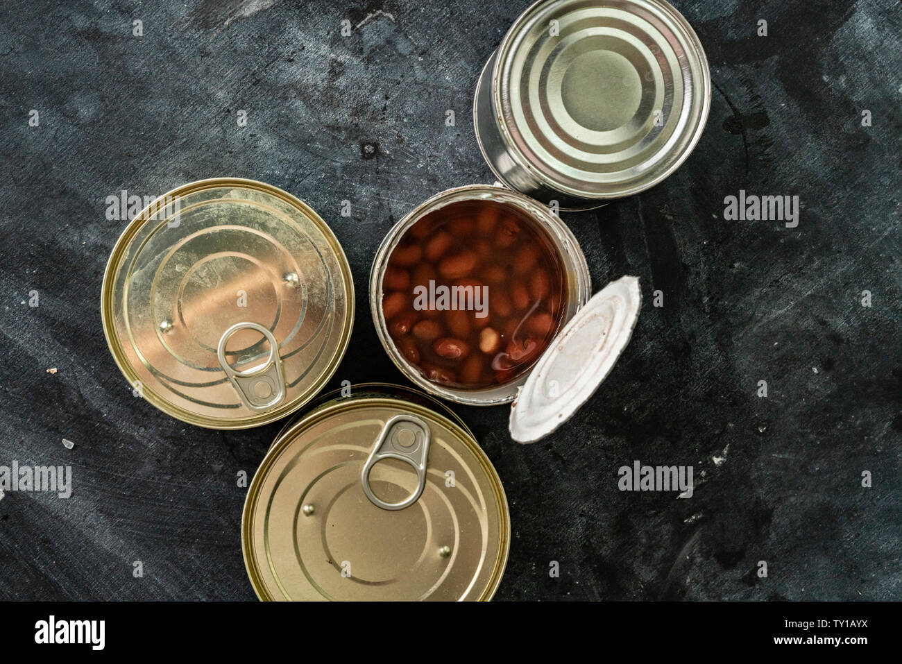 opened tin can on the table without leftovers from the food, meal ...