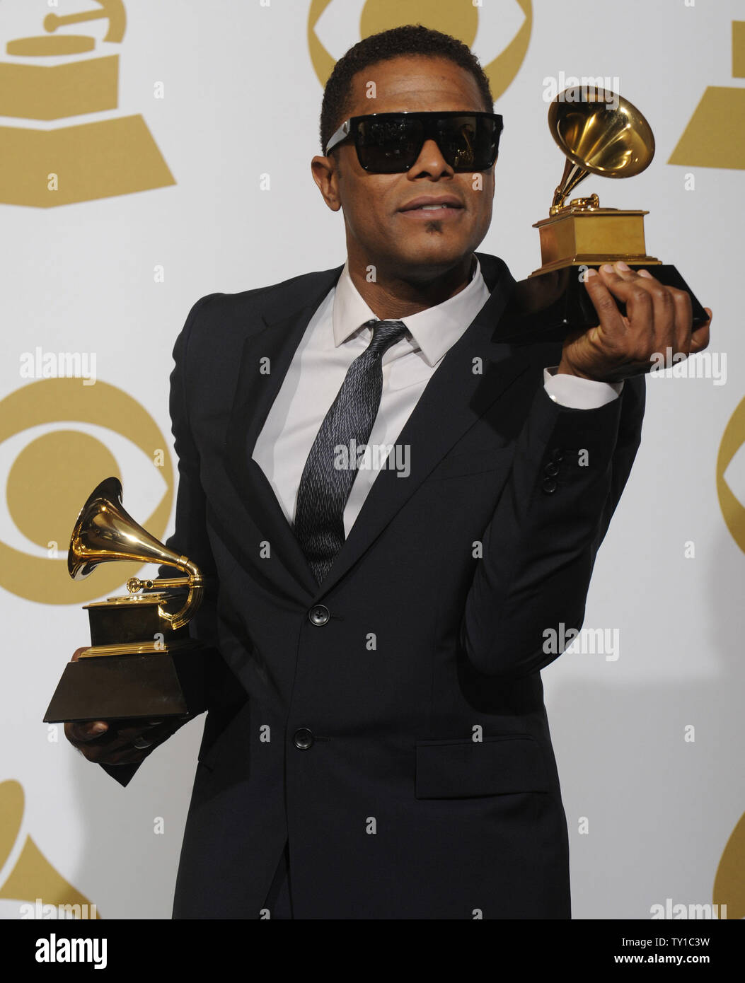 Maxwell holds his two awards at the 52nd annual Grammy Awards at the ...