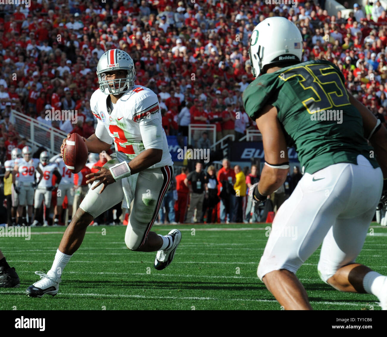 Ohio State Buckeyes' quarterback Terrelle Pryor (2) scrambles into ...