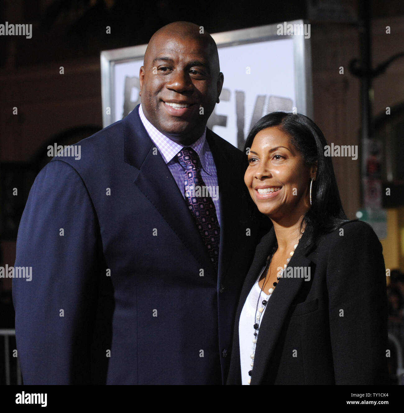 Earvin "Magic" Johnson and his wife Cookie attend the premiere of the ...