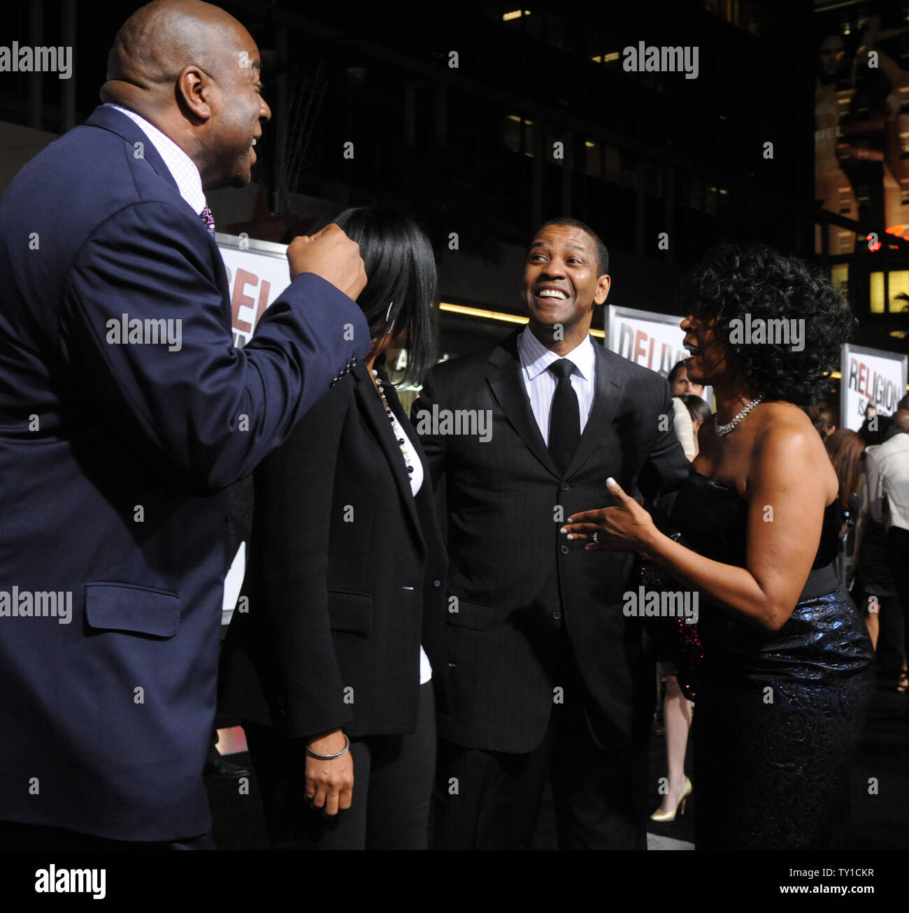 Cast member Denzel Washington (3rd-L) and his wife Pauletta (R) are ...