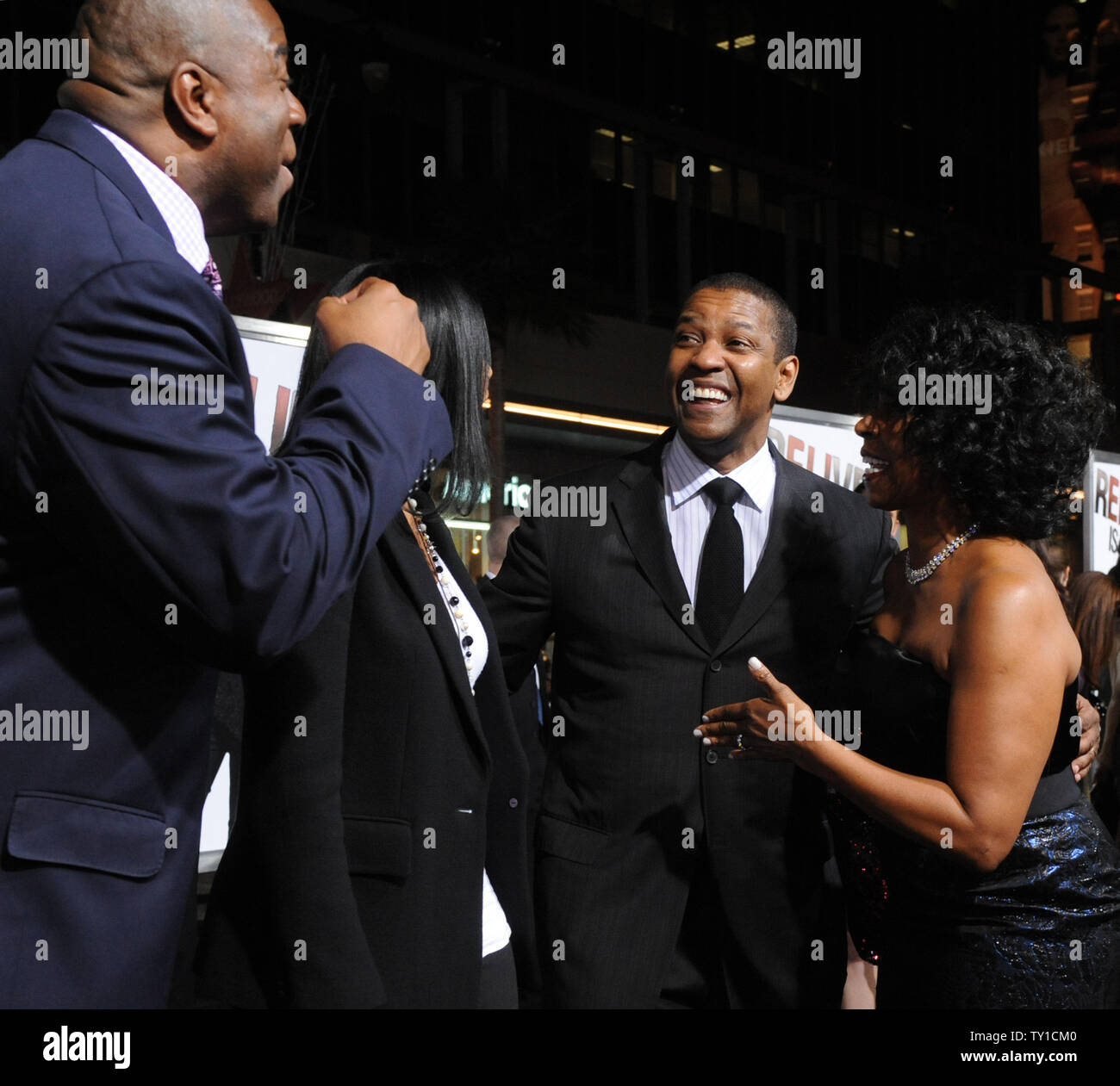 Cast member Denzel Washington (3rd-L) and his wife Pauletta (R) are ...