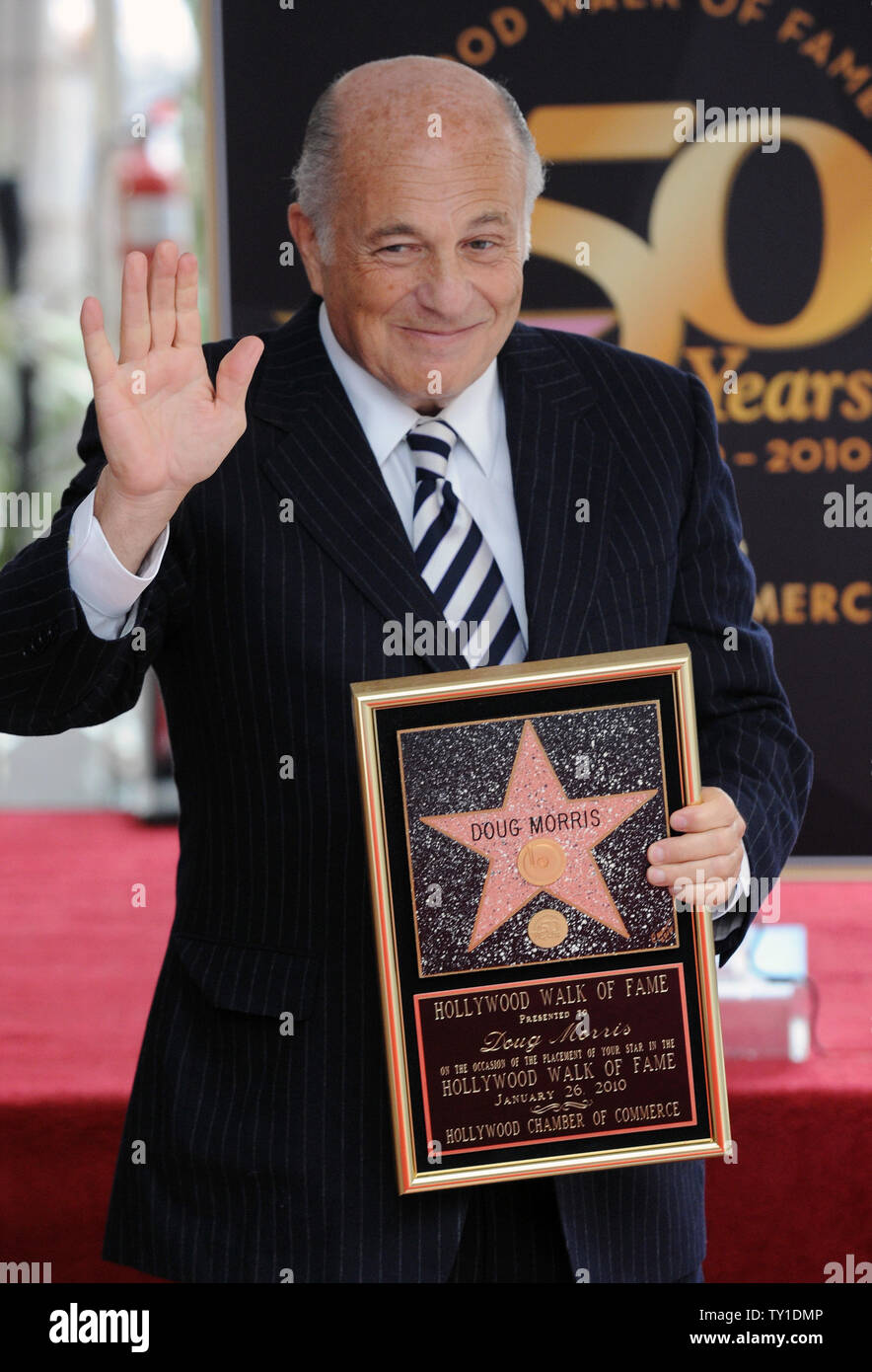Universal Music Group Chairman and CEO Doug Morris, holds a replica ...