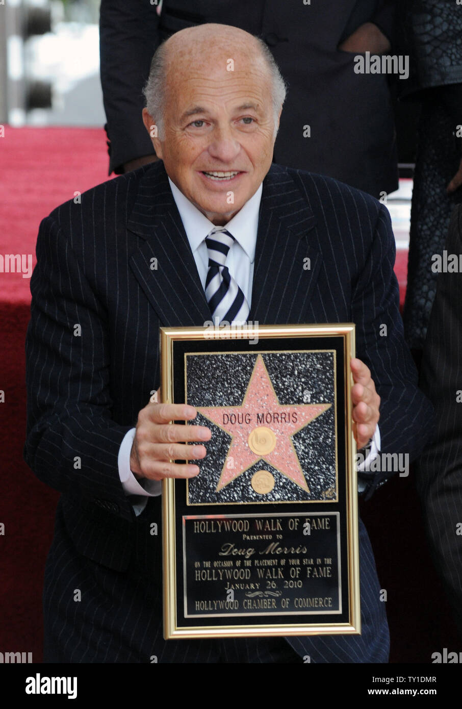 Universal Music Group Chairman and CEO Doug Morris, holds a replica ...