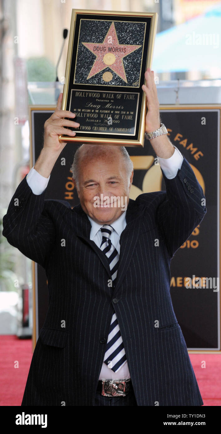 Universal Music Group Chairman and CEO Doug Morris, holds a replica ...